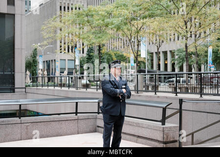 Bored security guard in a an empty room Stock Photo - Alamy