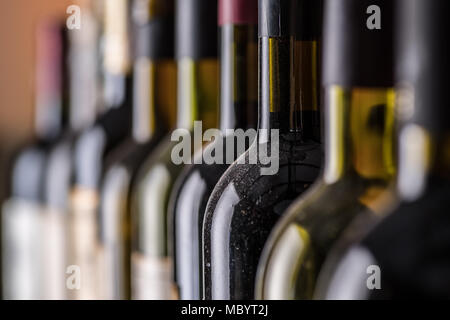 Line of wine bottles. Close-up Stock Photo - Alamy