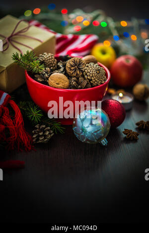 Christmas tree branches cones and nuts. Christmas wooden background ...