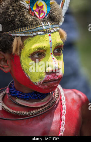 A young Huli boy with red and yellow face painting, Mount Hagen ...