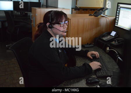 Rebecca Winans, Fort Carson Fire Department dispatcher, answers a 911 ...
