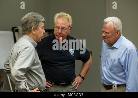 FEMA Federal Coordinating Officer Michael Byrnes administers the oath ...