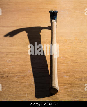 claw hammer shadow on wood Stock Photo - Alamy