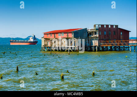 An abandoned fish cannery in the harbor of the Coquille River in Bandon ...
