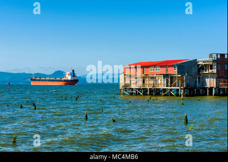 An abandoned fish cannery in the harbor of the Coquille River in Bandon ...