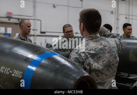 Airman Chad McCannon, 2nd Munitions Squadron conventional maintenance crew chief, scrolls ...