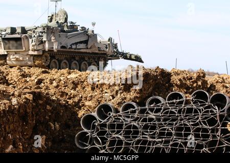 A "Terrier" armored digger from the United Kingdom's 22nd Engineer ...