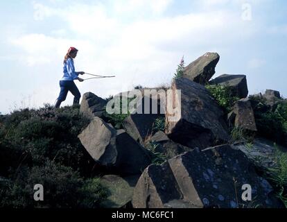 DOWSING Girl dowsing on the edge of Dimples Quarry, Haworth Moors ...