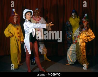 Stage Magic - Disappearing Girl. A girl is carried on a sheet of glass ...