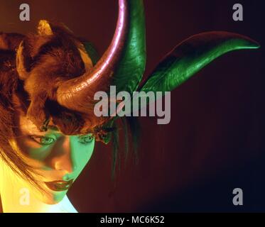 Black Magic Female manniken wearing a pair of goat horns, which were ...