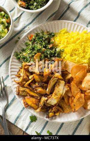 Plate with tasty doner kebab and vegetables on light background with ...