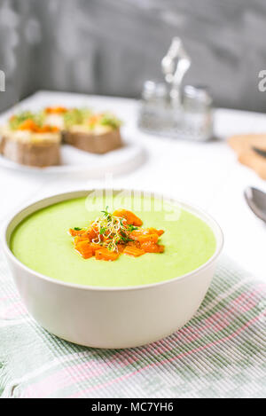Green microgreen peas on the wooden table, grown at home. Healthy food ...