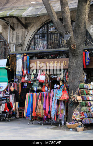 Turkish man selling clothing and fabrics at a bazaar in Belek, Antalya ...