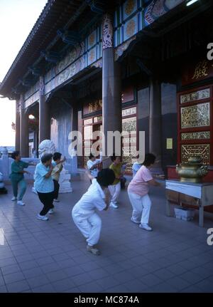 TAI CHI - Chinese practising Tai Chi before dawn, in the precinct of ...