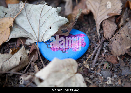 A hidden painted rock, part of the current trend for painting rocks and ...