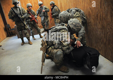 Team members handcuff the assailant Stock Photo - Alamy