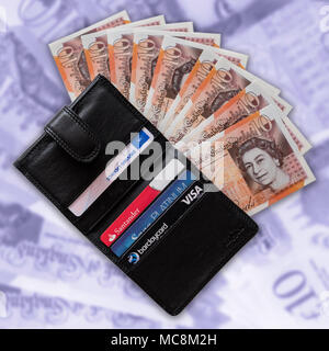 Fanned pound notes and open wallet Stock Photo - Alamy