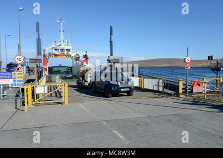 Ferry arriving at the ferry terminal on Fetlar one of Shetland's remote ...