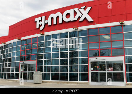 A logo sign outside of a TJ Maxx retail store location in Stafford ...