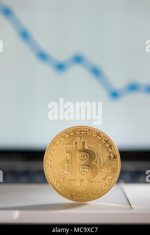 golden bitcoin on notebook Stock Photo - Alamy