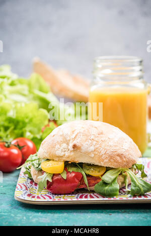 Diet bun with fresh vegetables and smoothie Stock Photo - Alamy