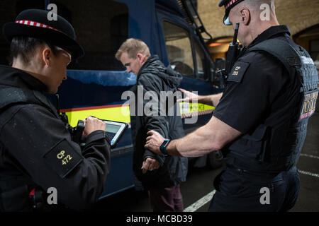 man and woman, male and female police community support officer, PCSO ...