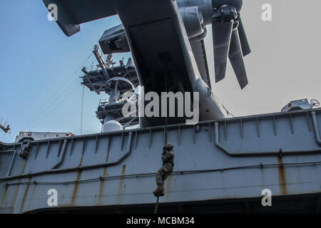 U.S. Marine fast-ropes from a tower aboard Marine Corps Base Hawaii ...
