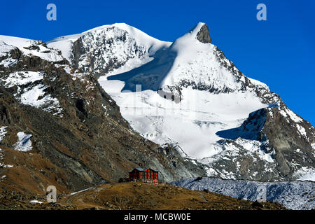 The historical Fluhalp mountain restaurant beneath the peaks Strahlhorn ...