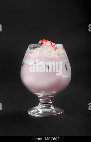 Glass of strawberry Pina Colada cocktail on color background Stock ...