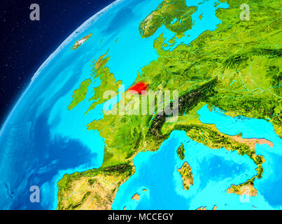 Orbit view of Belgium highlighted in red with visible borderlines and city lights on planet ...