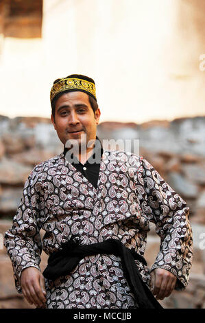 Iranian men wearing traditional Muslim religious clothes walk in a ...