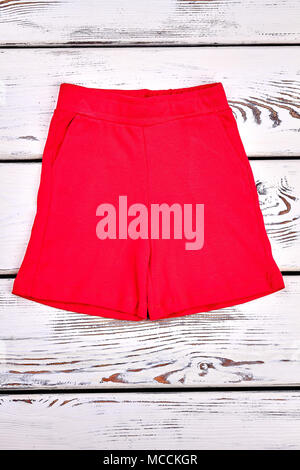 Kids red cotton shorts. Brand organic shorts for childrens isolated on ...