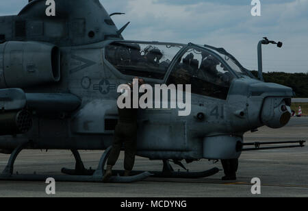 Capt. Justin P. Morrison and Capt. Kyle T. Myer takes off in an AH-1Z ...