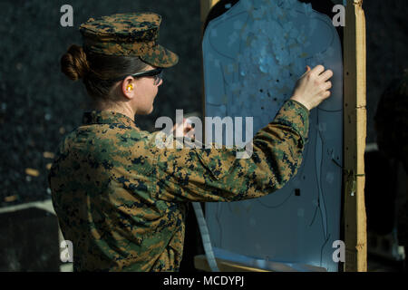 2nd Lt. Heidi Swisher fixes her target during an annual pistol ...