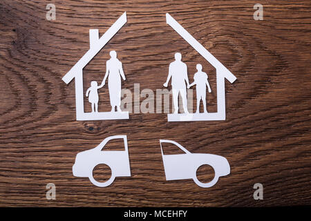 White Paper Cutout Of A Family Split Apart With Car Stock Photo - Alamy
