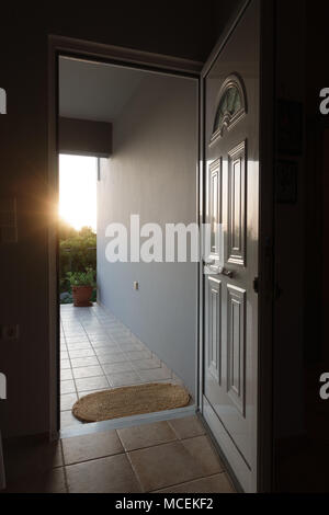 Sunlight shining through open door Stock Photo - Alamy