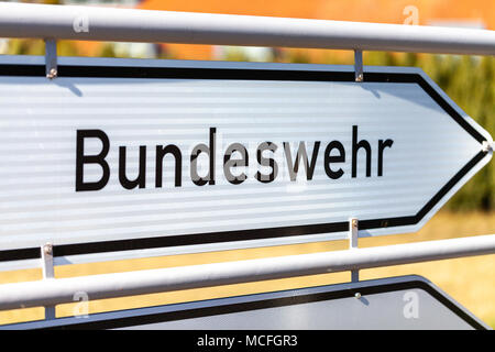 Logo of the German Bundeswehr (armed forces) on a heap on a table. Web ...