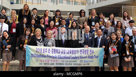 South Korean elementary and middle school students shout as they carry ...