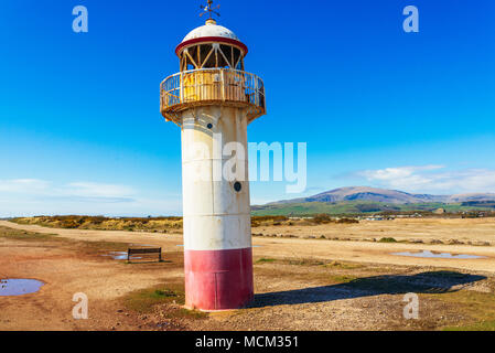Derelict lighthouse at Hodbarrow Point near Millom, Cumbria. with Black ...