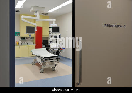 Intensive care unit in a hospital. A patient is connected to different ...