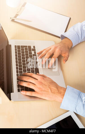 Businessman at work. Close-up top view of man working on laptop Stock ...