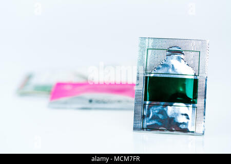 Mild steroid oral paste in aluminium foil sachet on blur background of ...