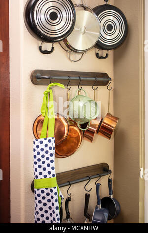 Copper Pots and Pans Hanging on the Wall Stock Photo - Alamy