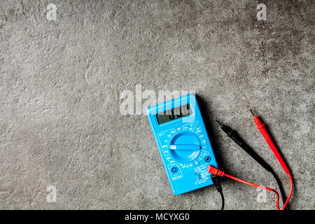 Digital multimeter on grey background Stock Photo - Alamy
