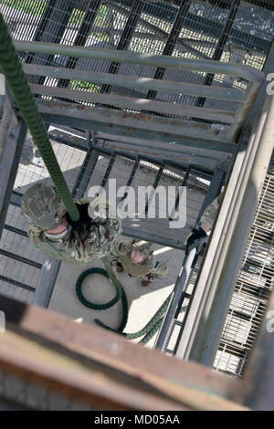 A Royal Marine Commando fast ropes from a Royal Air Force ...