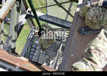 A Royal Marine Commando fast ropes from a Royal Air Force ...