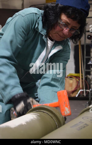 A Crane Army Ammunition Activity explosives handler displays a warning ...
