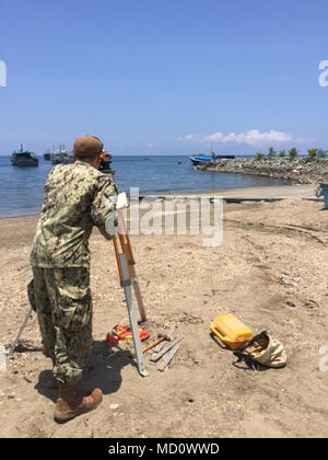 U.S. Navy Lt. Michael Roster, assigned to Underwater Construction Team ...