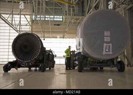 A KC-135 Stratotanker engine sits in front of a new KC-46 Pegasus ...