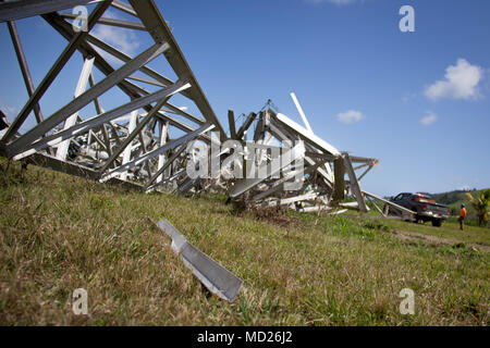 Storm-damaged lattice towers rest at the laydown yard while awaiting ...